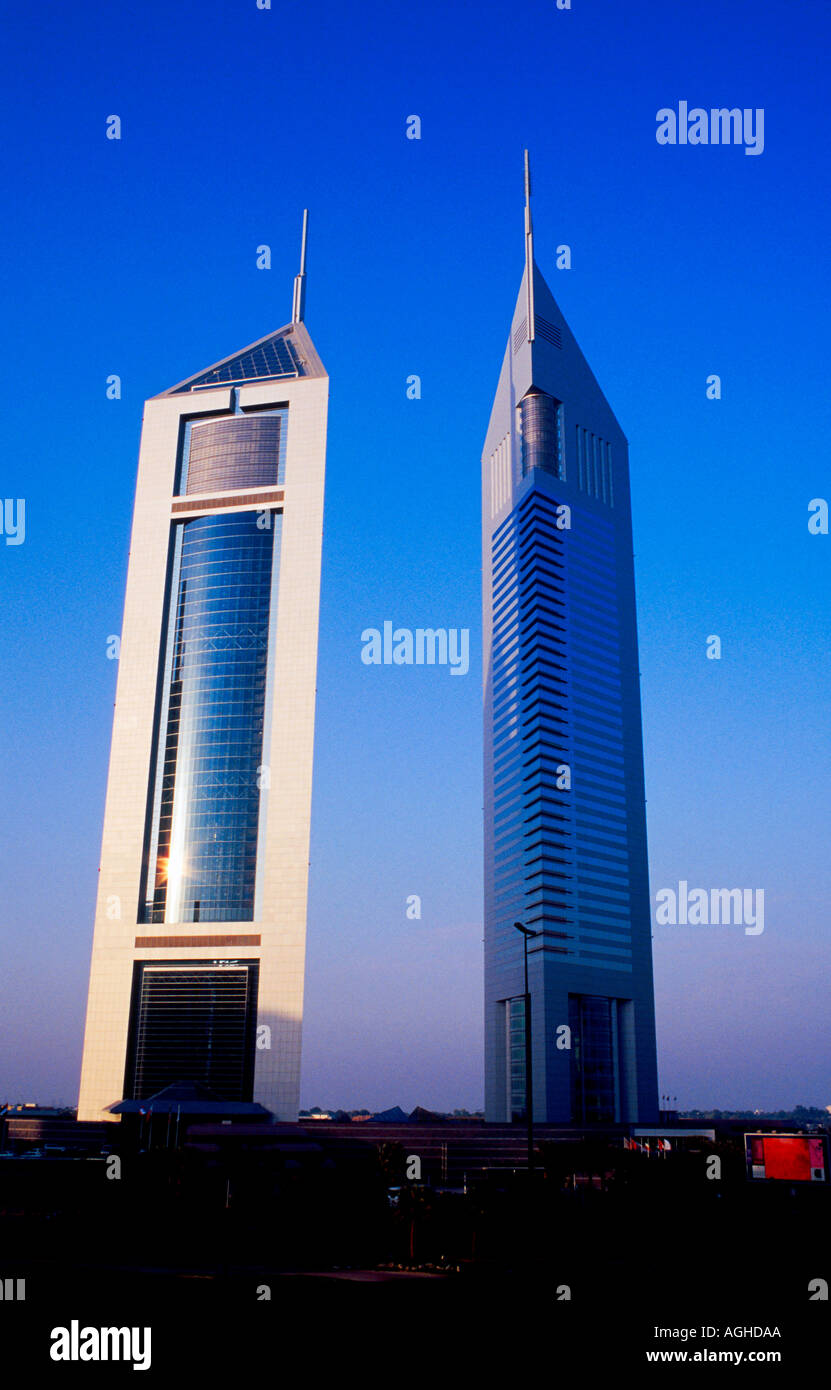 Emirates Towers lit by the falling sun at dusk. Sheikh Zayed Road ...