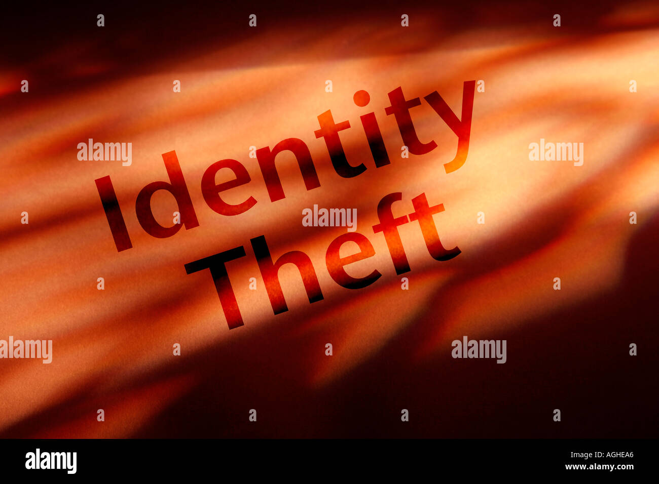 Identity theft on a red background Stock Photo - Alamy