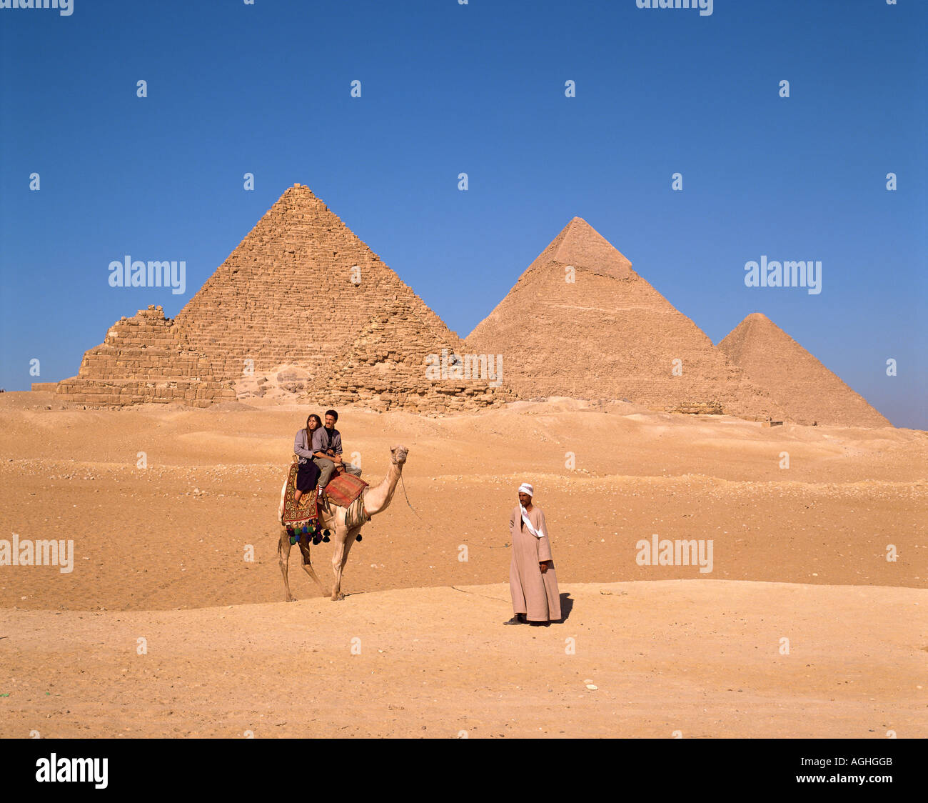 Egypt Cairo Giza The Great Pyramids Tourists Riding Camel Stock Photo ...
