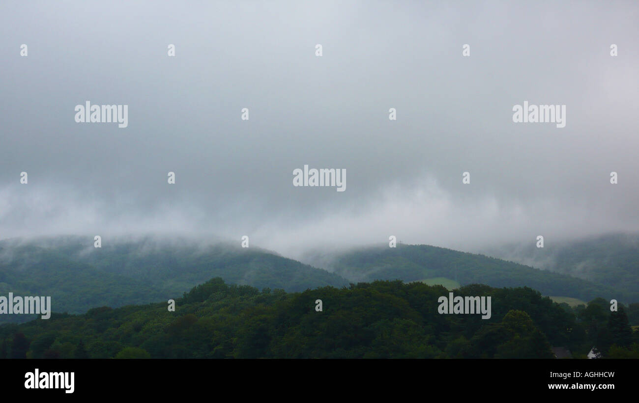 rain clouds over forest, Germany, North Rhine-Westphalia, Ruhr Area ...