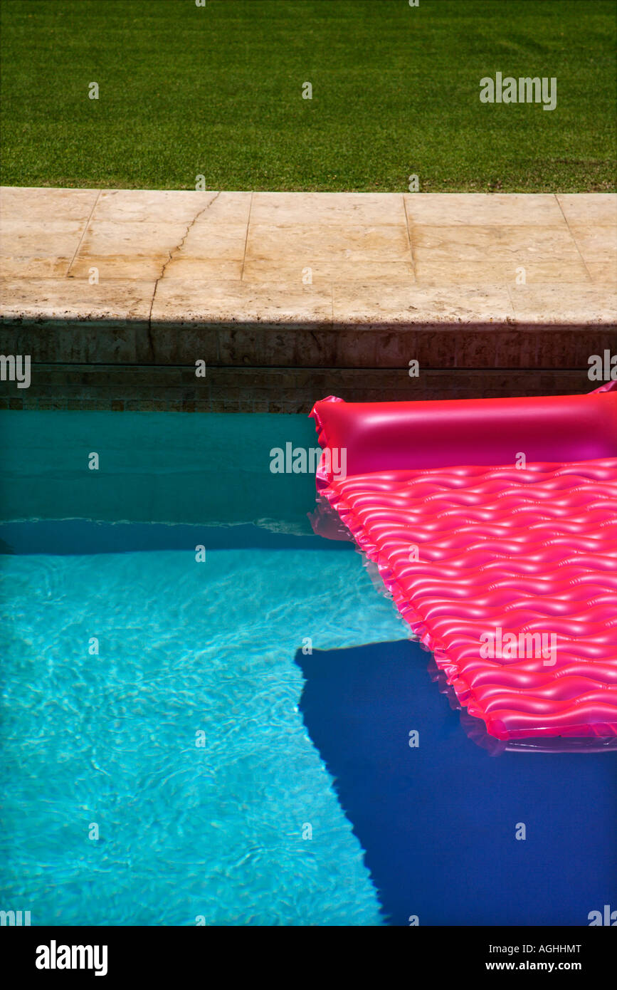 Pink float in empty swimming pool Stock Photo - Alamy