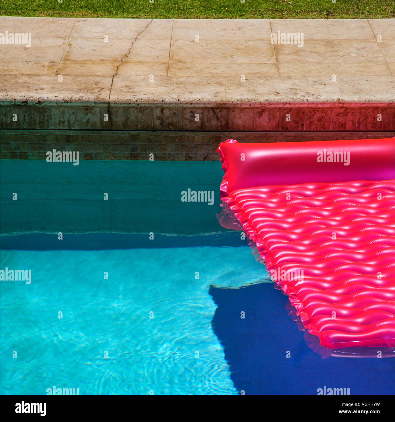 Pink float in empty swimming pool Stock Photo - Alamy