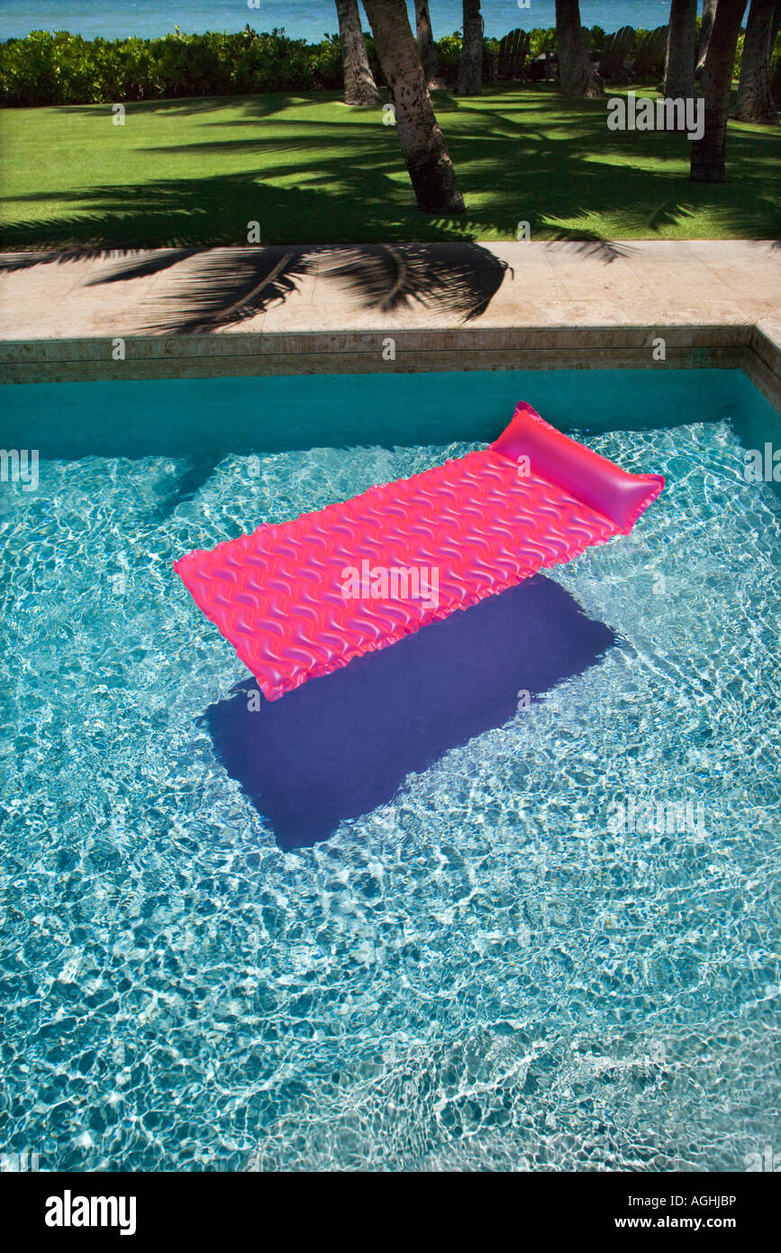 Pink float in empty swimming pool Stock Photo - Alamy