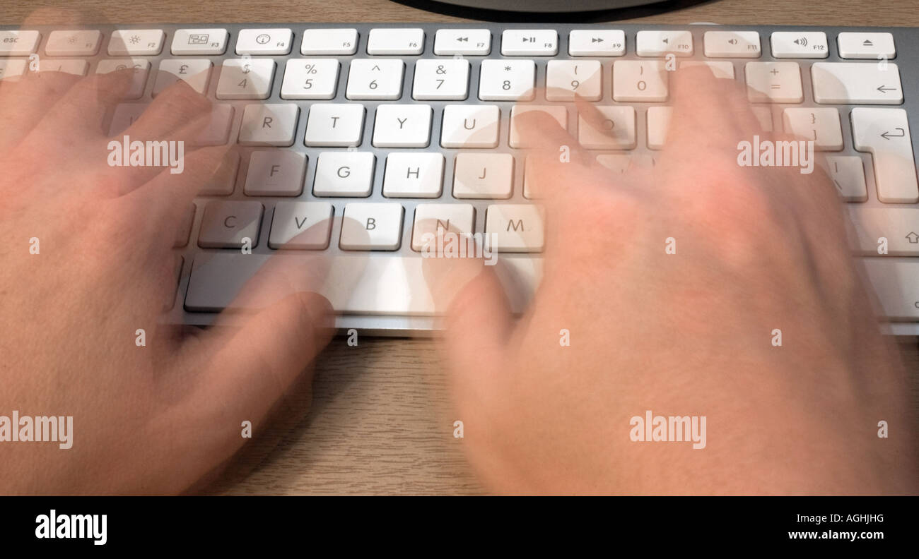 Fast typing hands on an Apple Mac slim Keyboard Stock Photo - Alamy