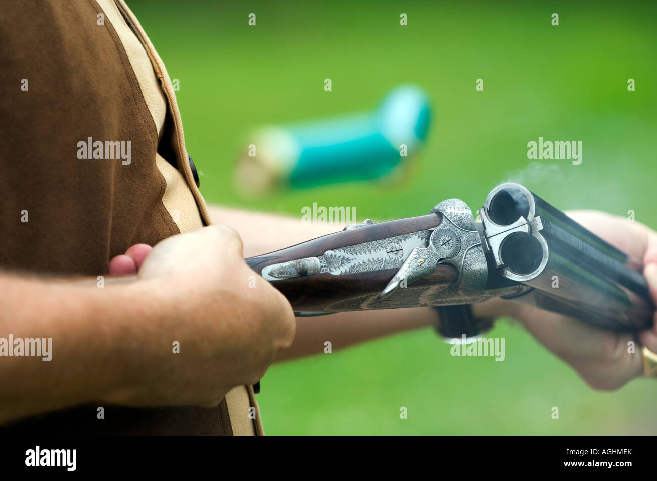 Two cartridges ejecting from a shotgun Stock Photo - Alamy