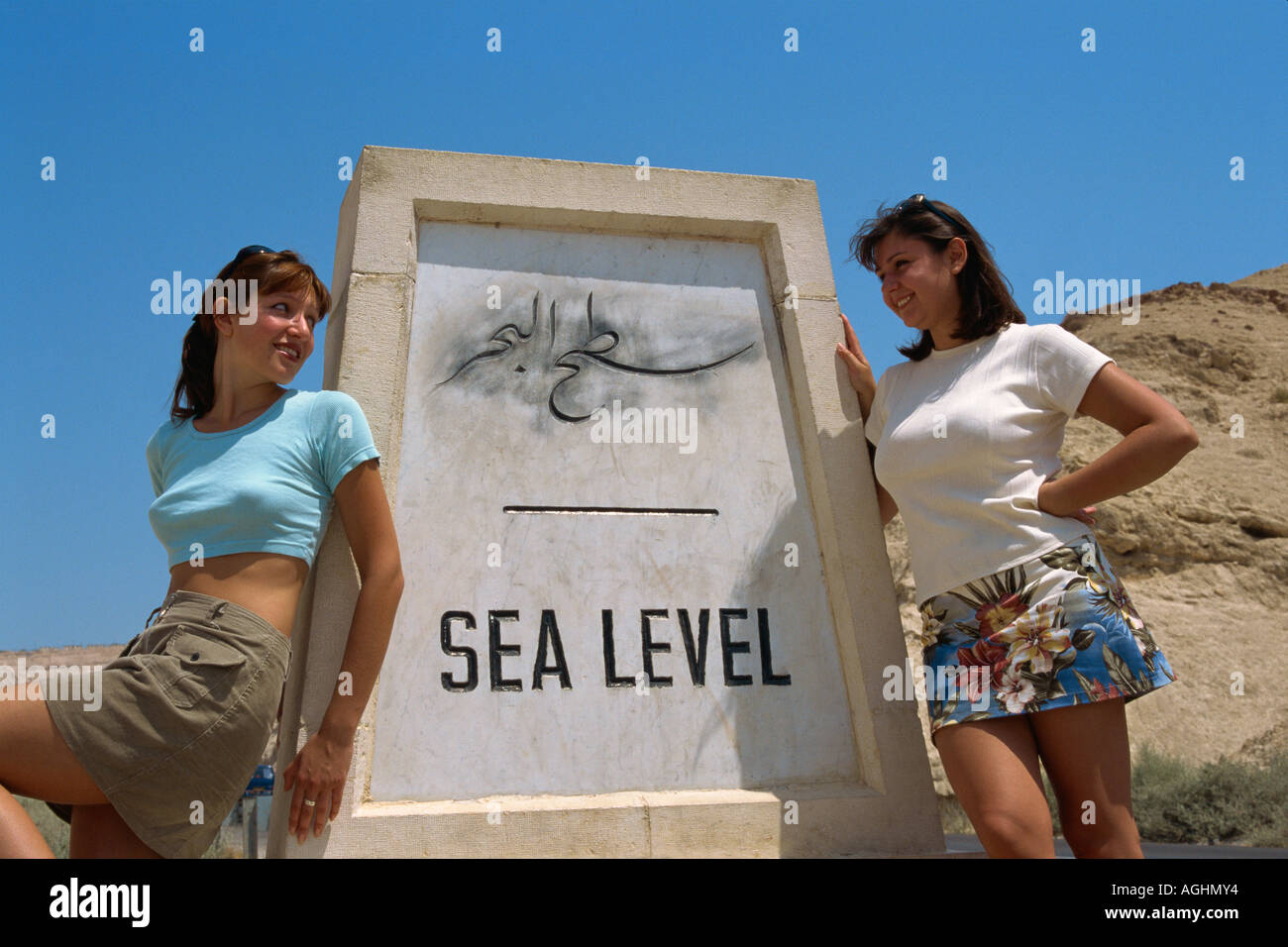 Israel Young Women at Sea Level Sign Stock Photo - Alamy