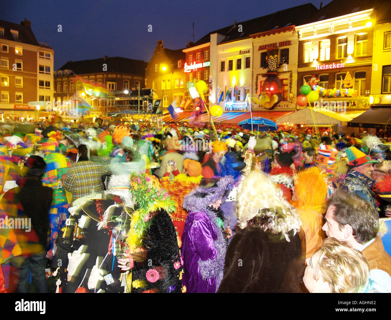 crowd of people in colourful costumes dancing at carnival festival at ...