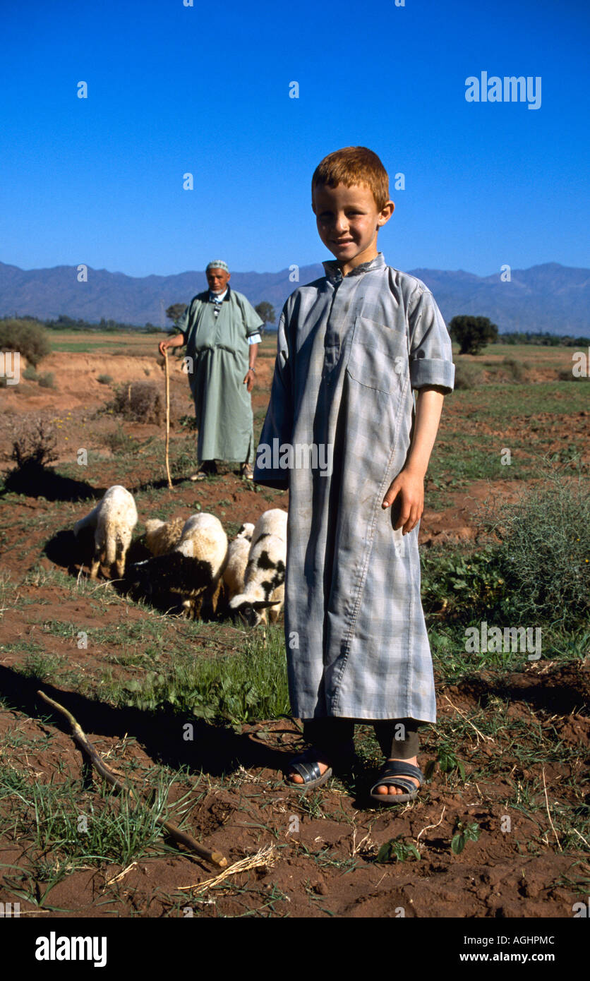 young berber shepherd boy with red hairs in traditional clothing south ...