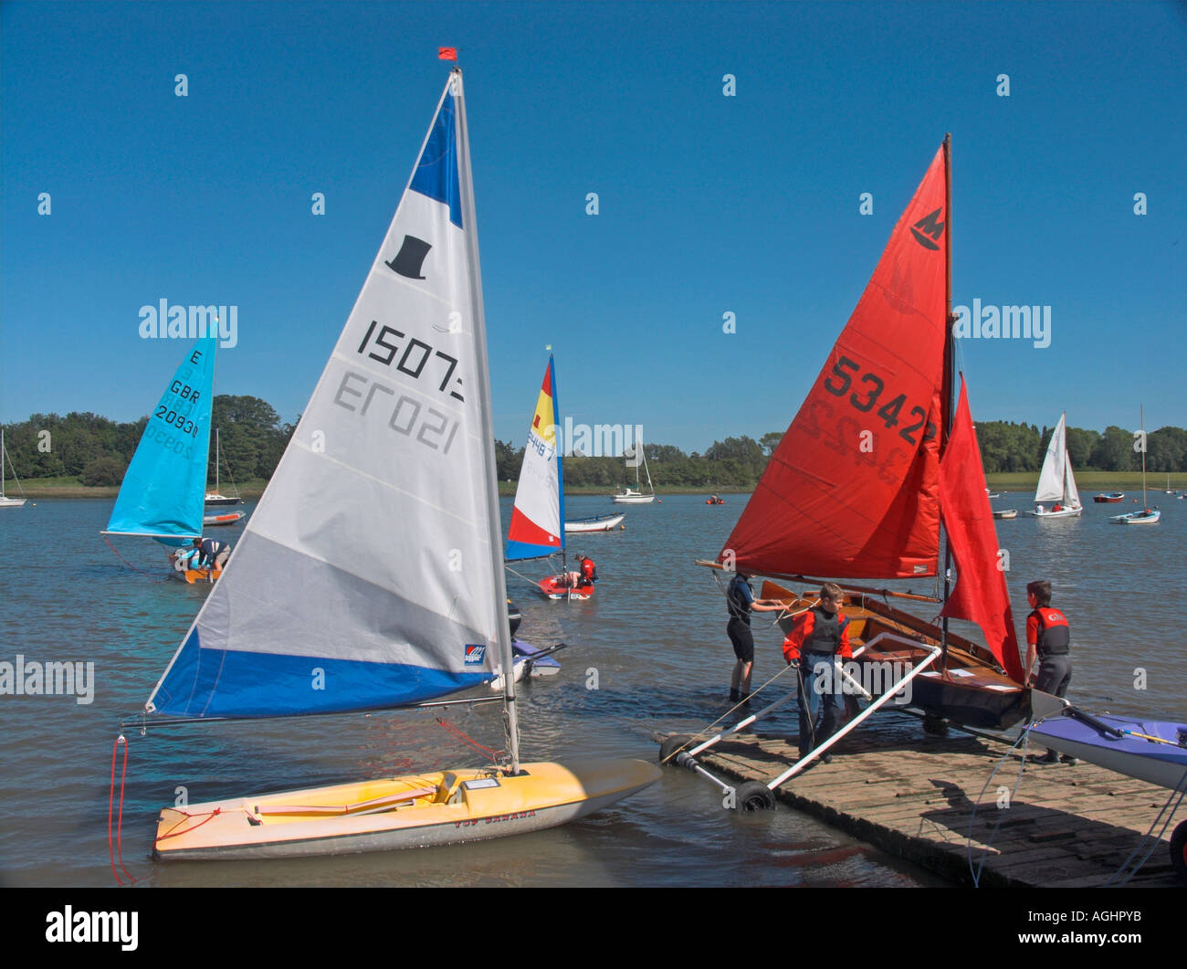 Topper and Mirror class sailing dinghy being launched River Deben ...