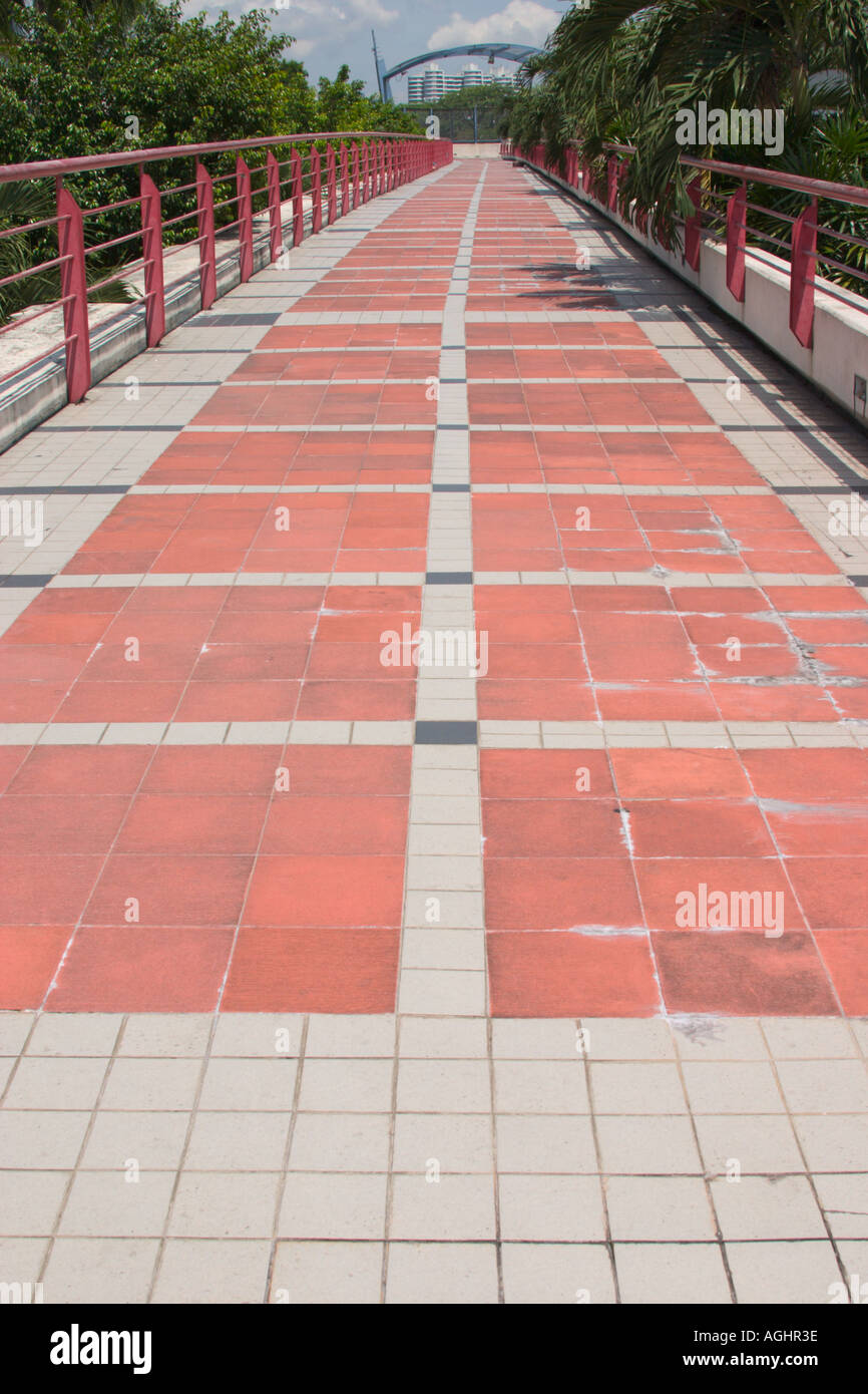pink walking path leading to a distance in malaysia Stock Photo - Alamy