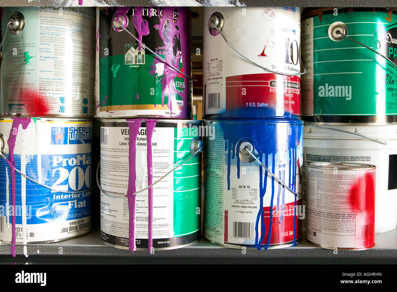 Cans covered with spilled paint Stock Photo - Alamy