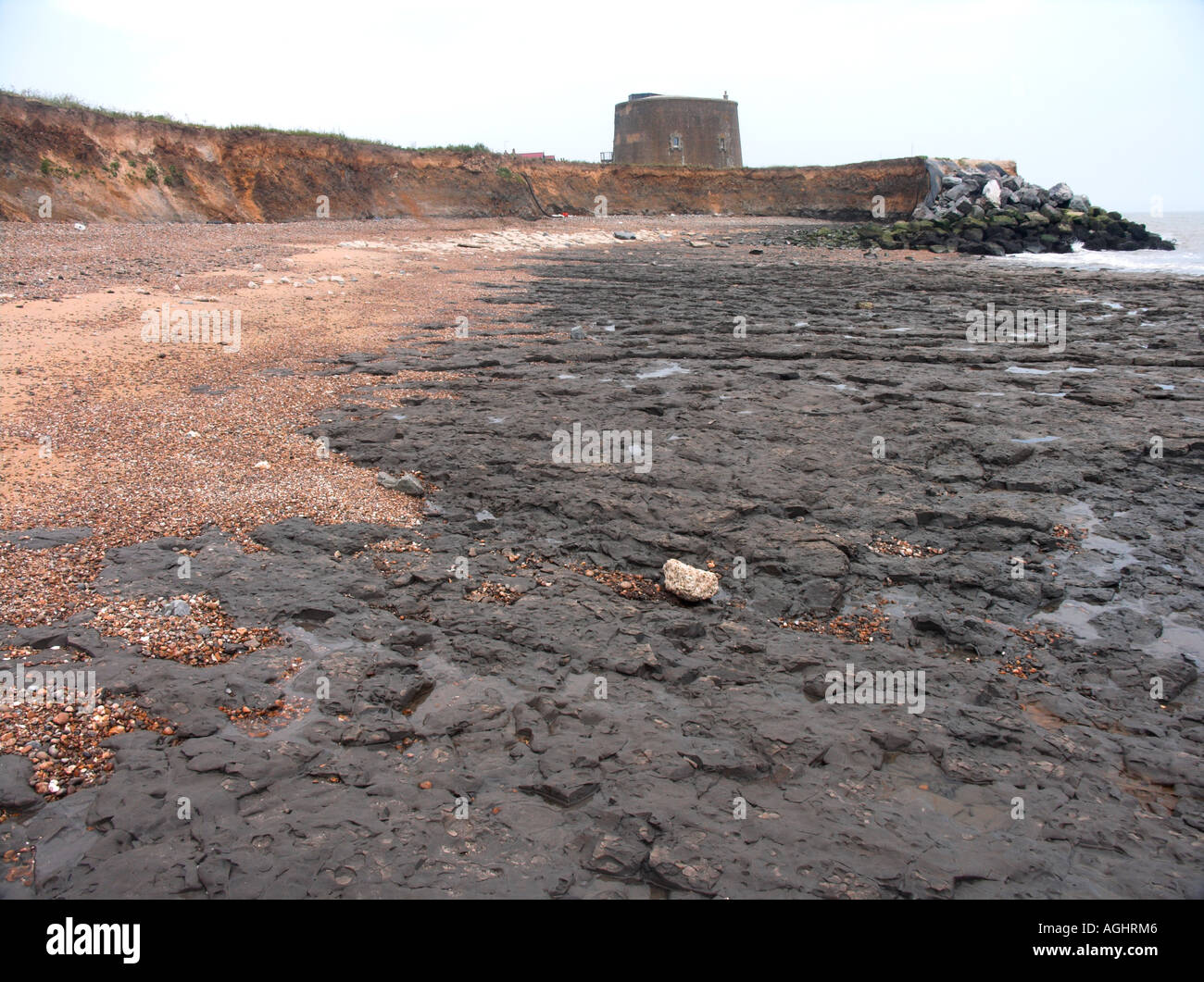 Wave cut platform cliff recession martello tower Bawdsey, Suffolk Stock ...