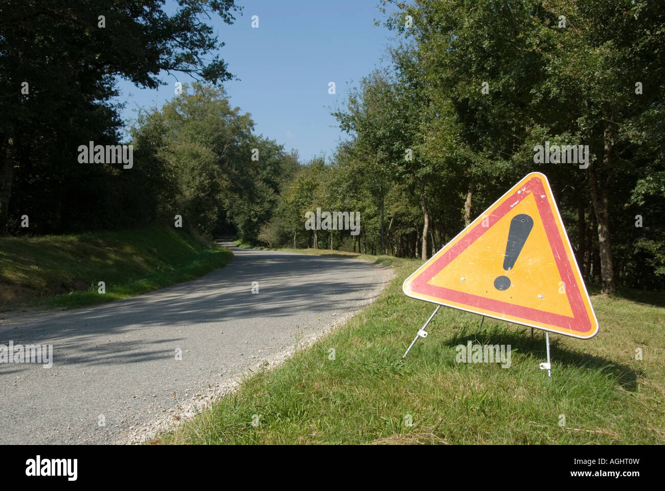 Image of a road warning sign showing an exclamation mark just before a ...