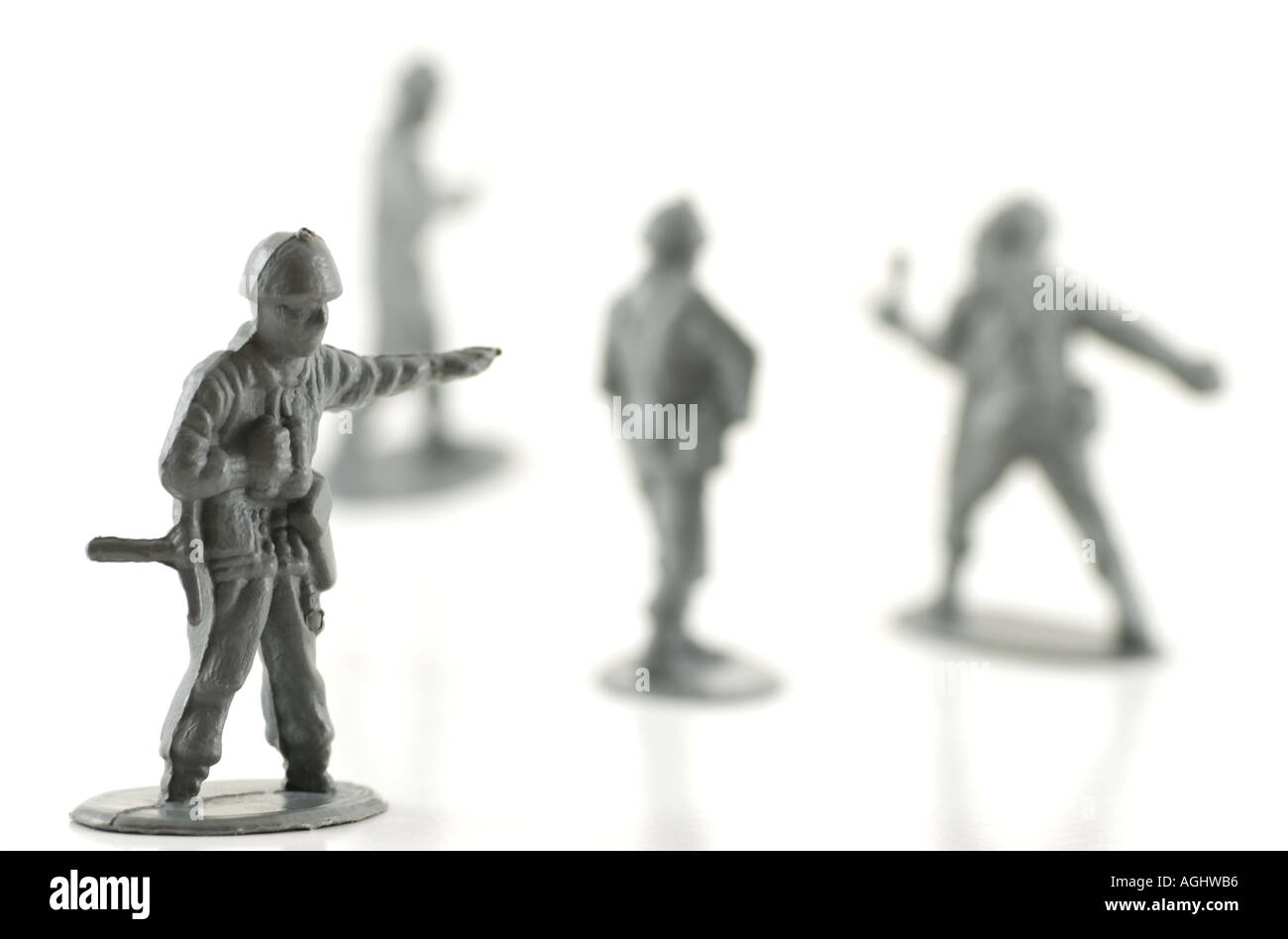 Group of grey toy soldiers in action Stock Photo - Alamy