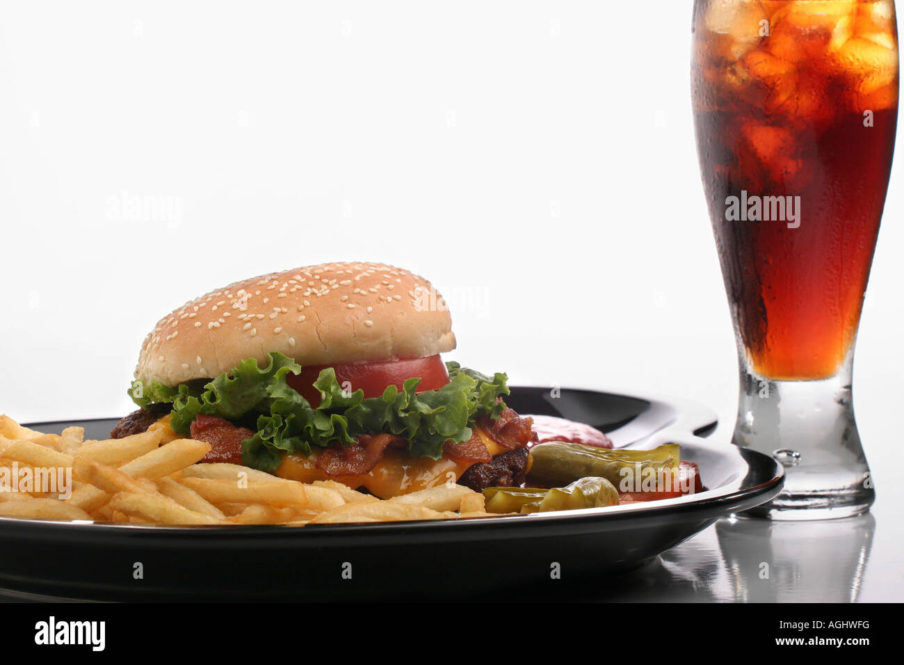 Hamburger with French Fries fry on a plate and Coca Cola drink in a ...
