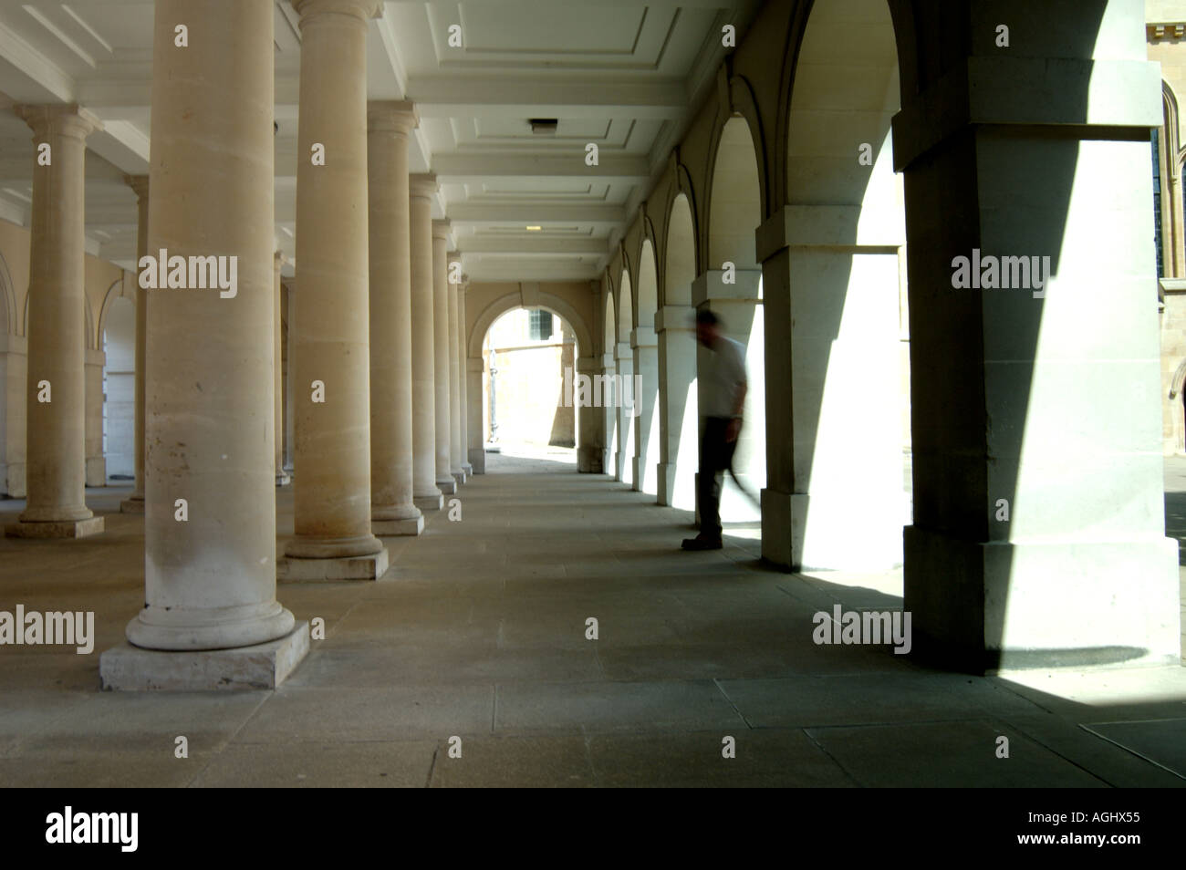 a man walking through Temple Stock Photo - Alamy