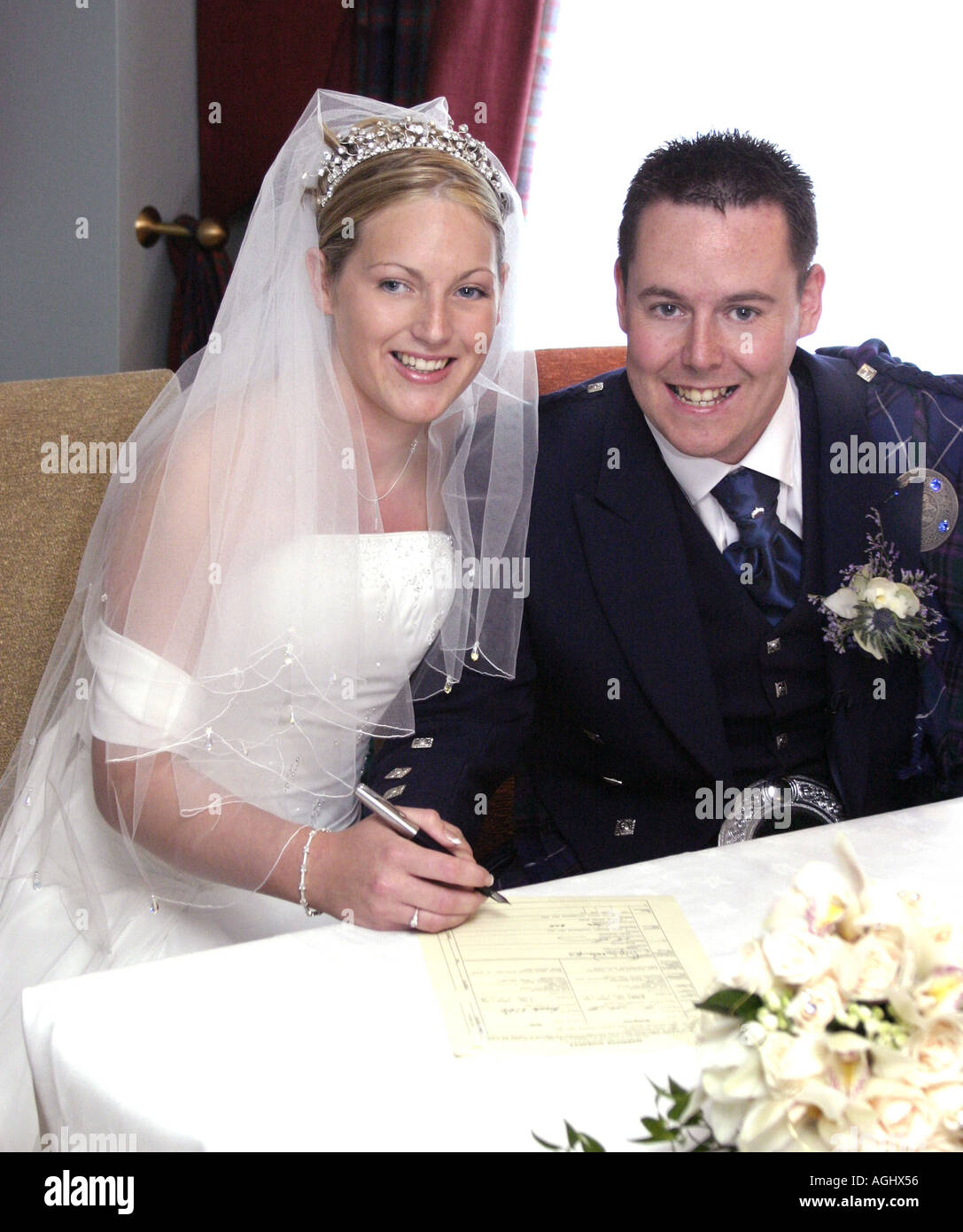 Couple signing a marriage register hi-res stock photography and images ...