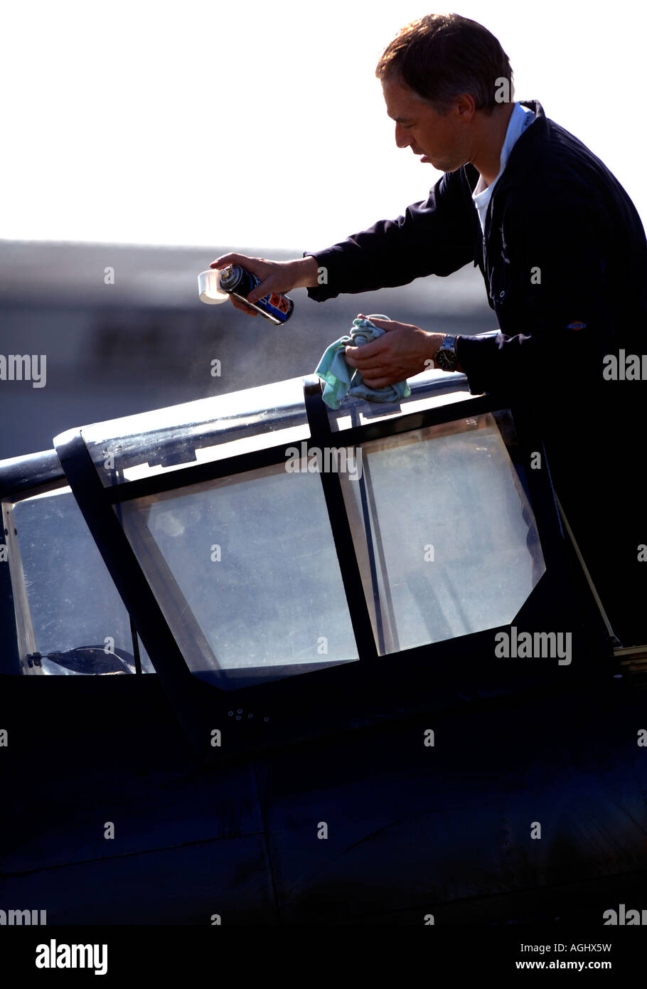 Cleaning plane window with cloth High Resolution Stock Photography and ...