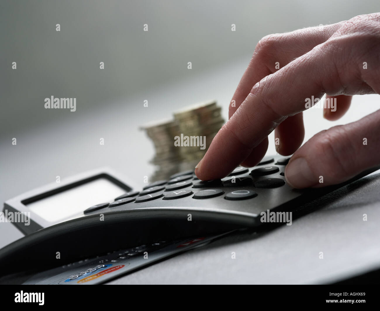 close up of person using modern calculator and some currency and credit ...