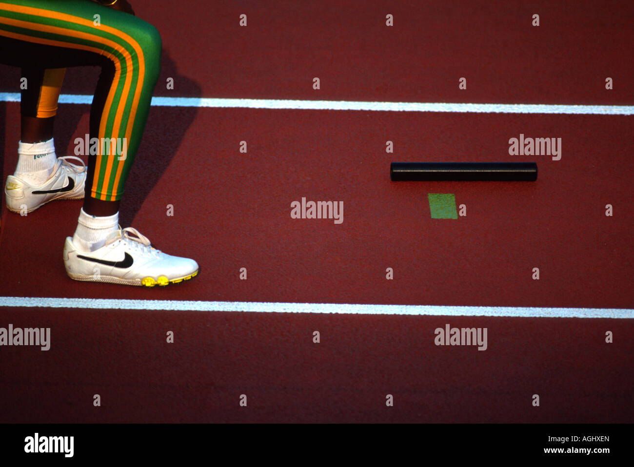 A track athlete prepares for the start of a 400M relay race Stock Photo ...