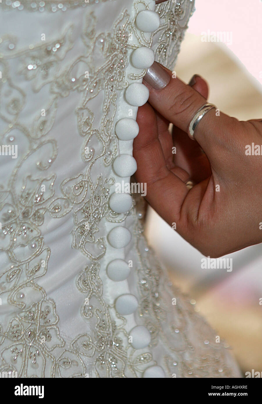 Wedding dress buttons hi-res stock photography and images - Alamy