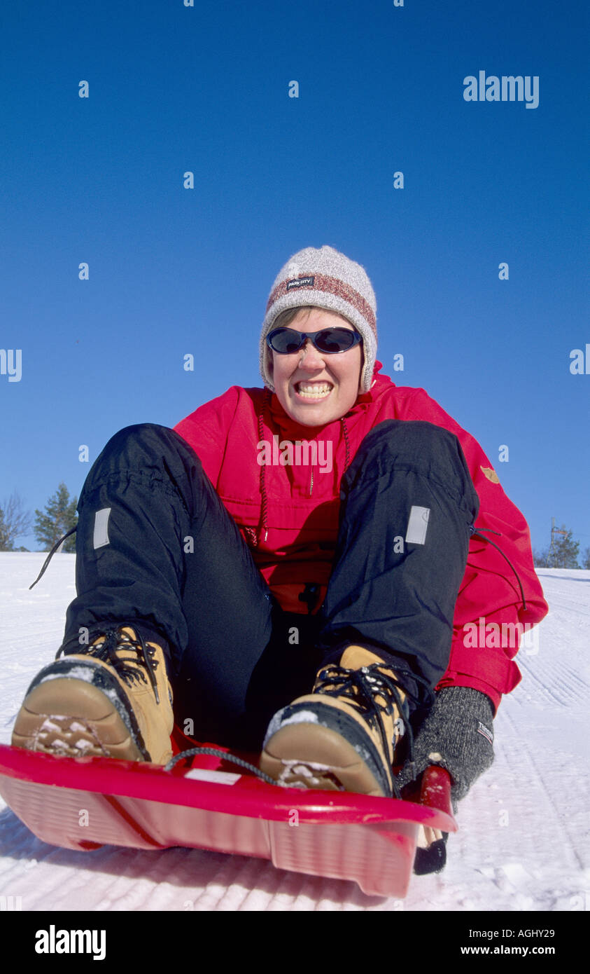 Woman riding a sledge. Sweden Stock Photo - Alamy