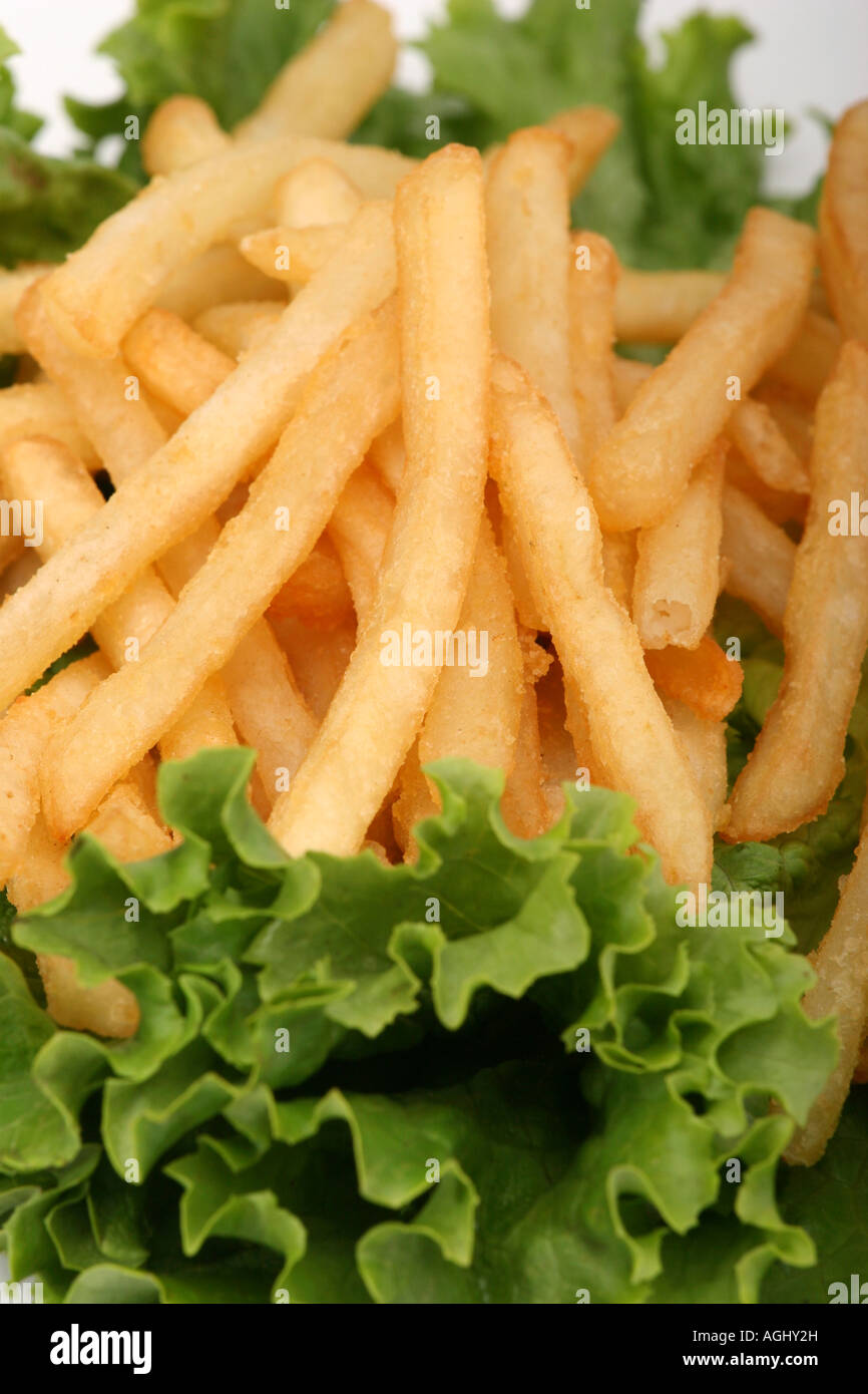 French fries in a green lettuce fast food fresh blur background from ...