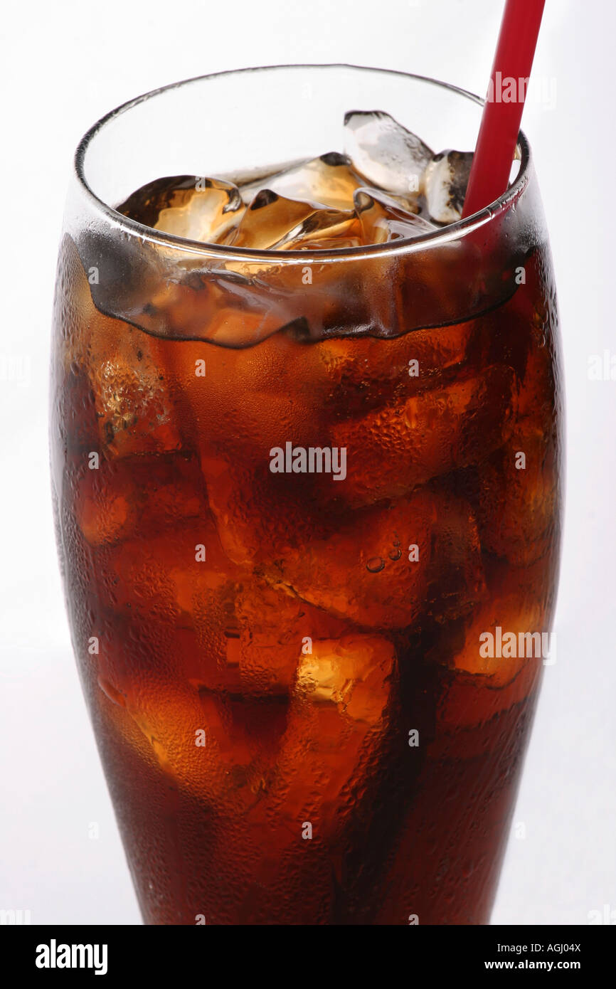 Coca Cola in a glass with ice cubes and straw to drink nobody cut out ...