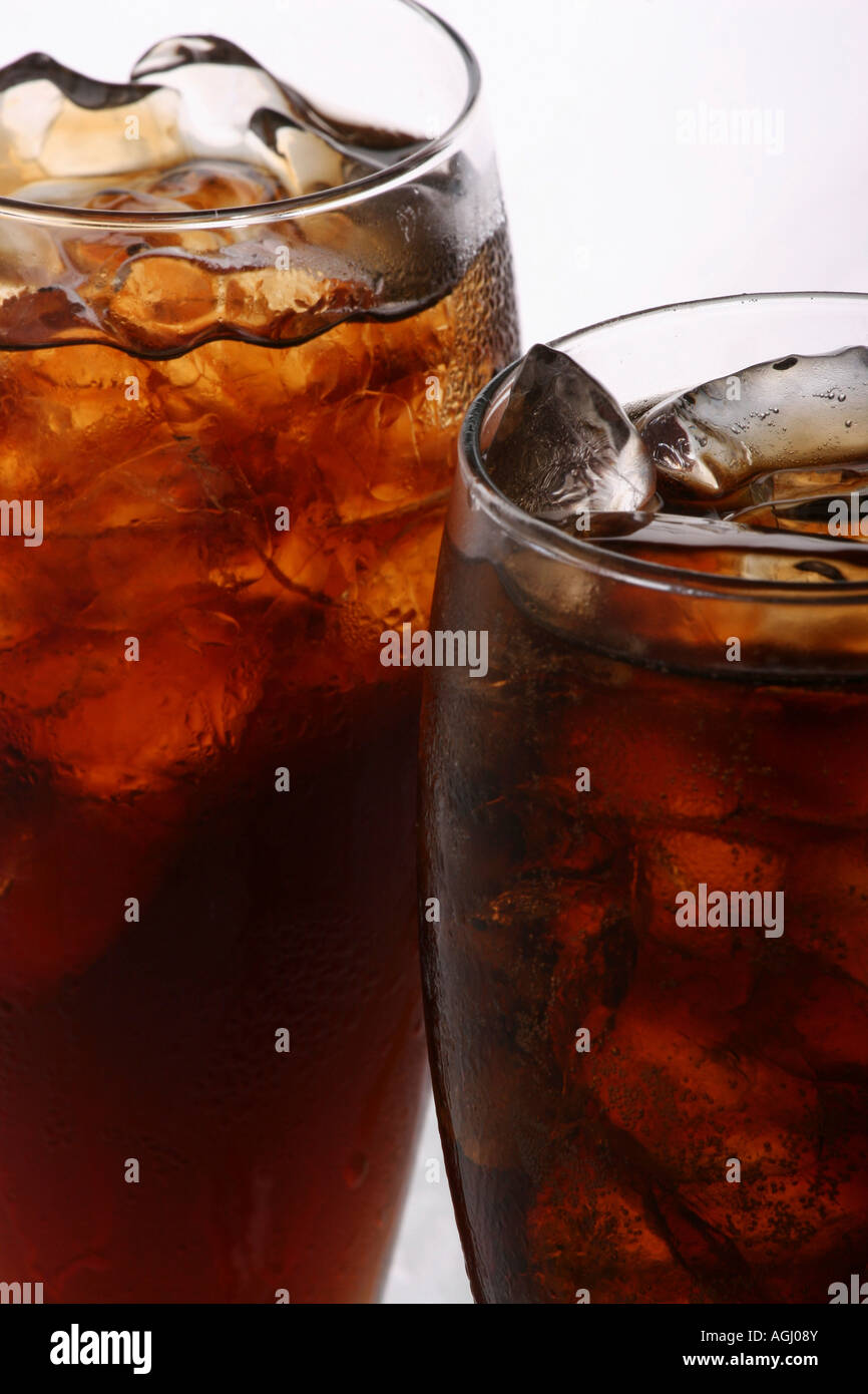 A glass of Coca Cola with ice cubes on wihte background Coke soft drink ...