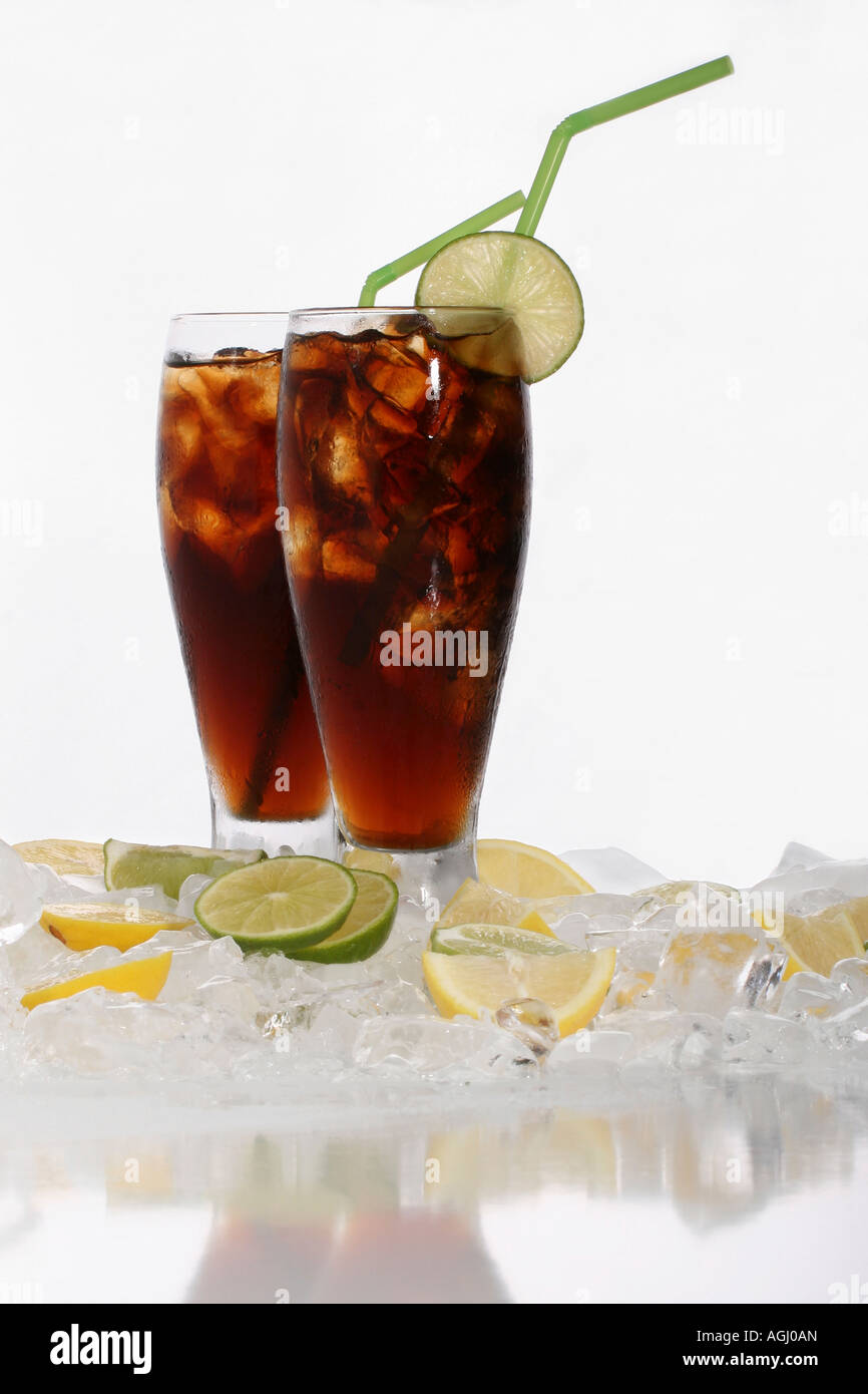 Coca Cola With Ices Cubes And A Slice Of Lemon Poured Into A Glasses