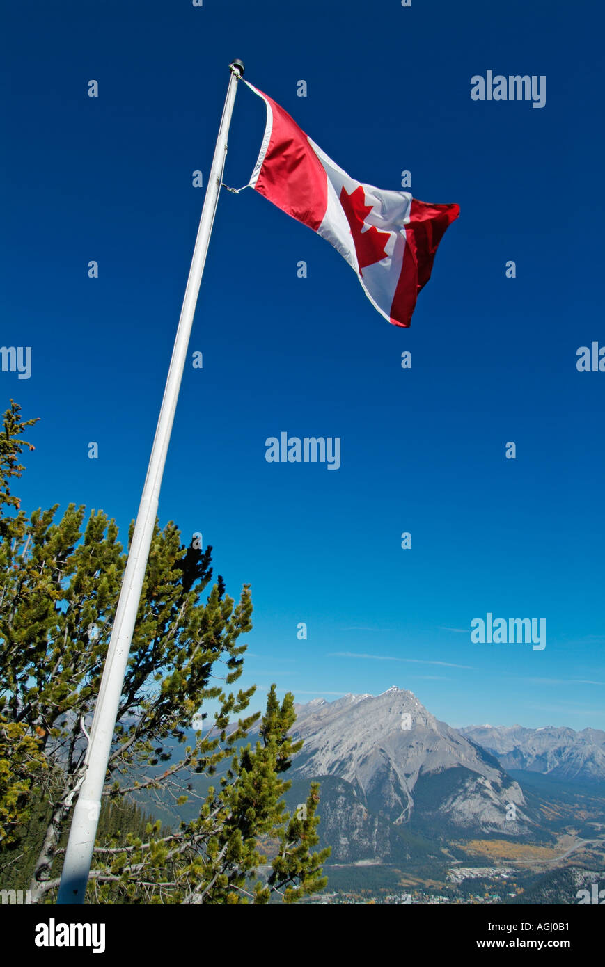 Canadian Flag on Sulphur mountain overlooking Banff township and ... Canadian Flag on Sulphur mountain overlooking Banff township and ...