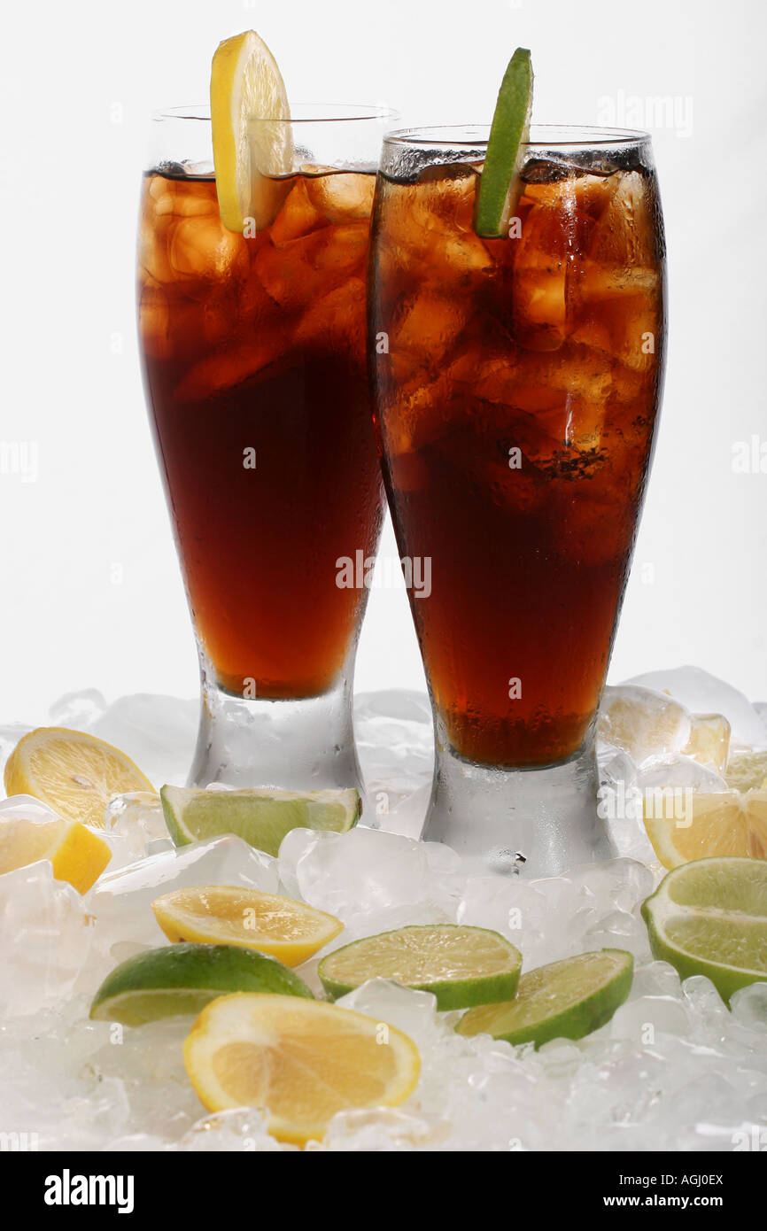 A Coca Cola Poured In A Two Glasses With Ice Cubes Slice Lemon Lime