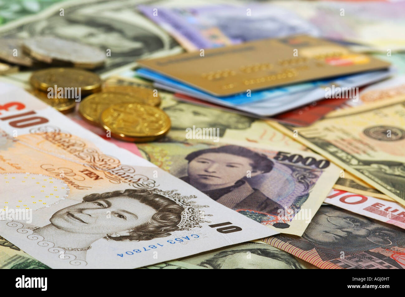 Different currencies organized as a background coins in stacks and ...