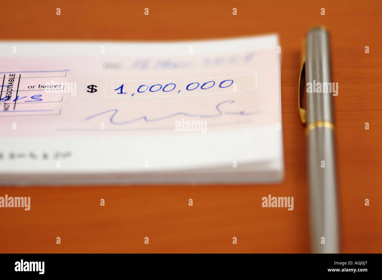 One million dollars cheque and a pen Stock Photo - Alamy