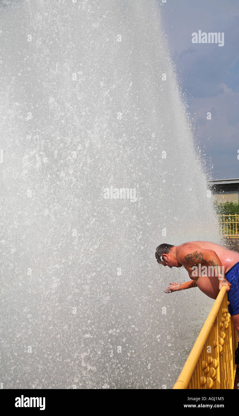 Man cooling off in fountains at Battersea Park Stock Photo - Alamy