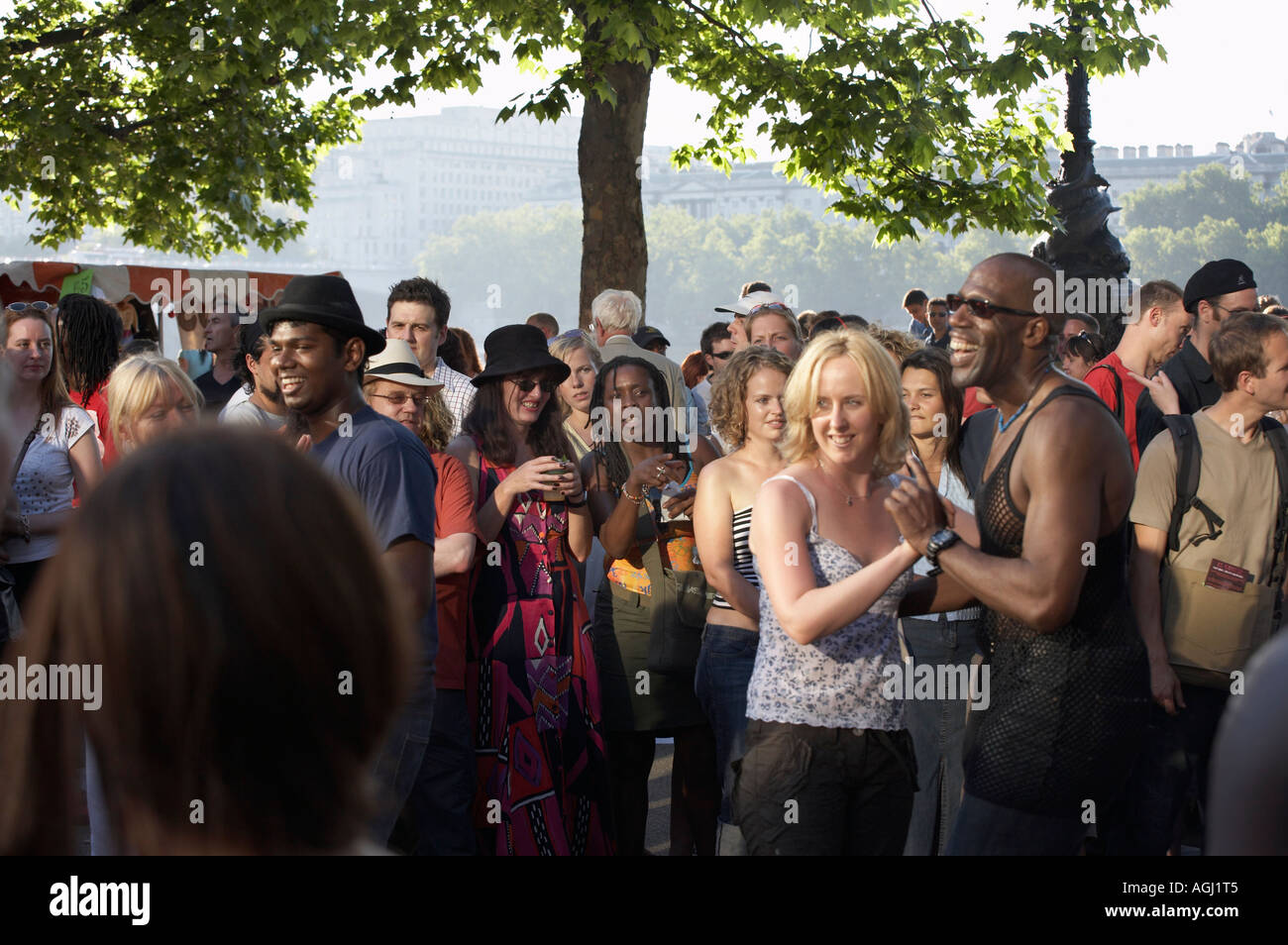 Salsa dancing group on the south bank of the River Thames in London ...