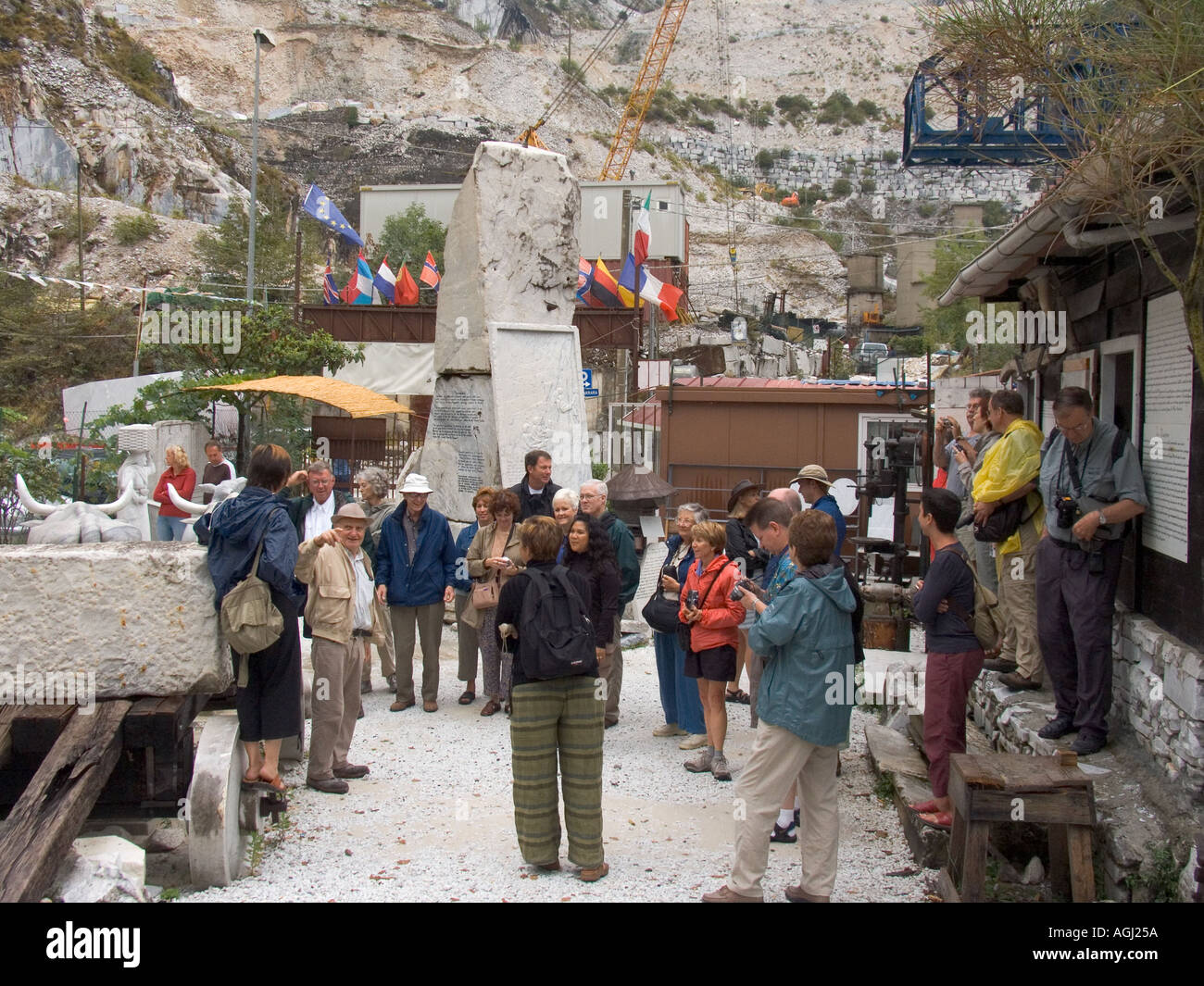 Tour group listens to old miner teach about mining at marble quarry in ...