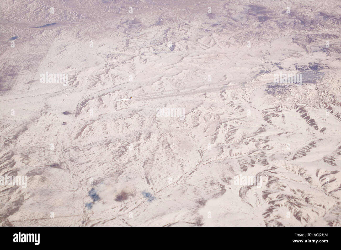 A jet flying over the Siberian tundra from the air Stock Photo - Alamy