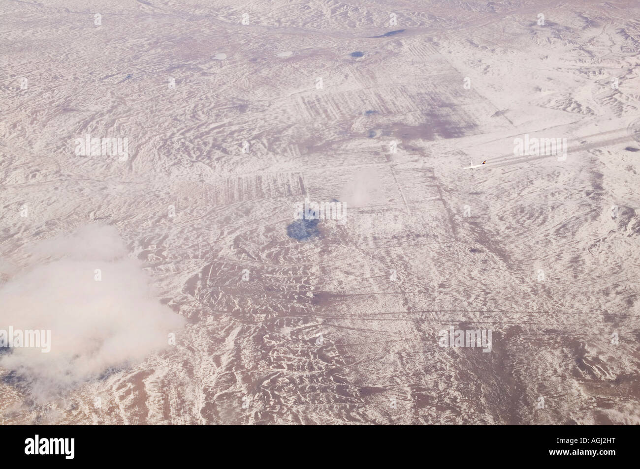 A jet flying over the Siberian tundra from the air Stock Photo - Alamy