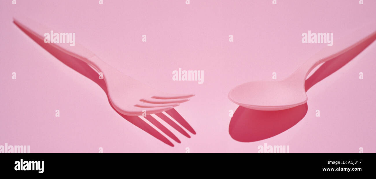 Pink plastic fork and spoon Stock Photo - Alamy