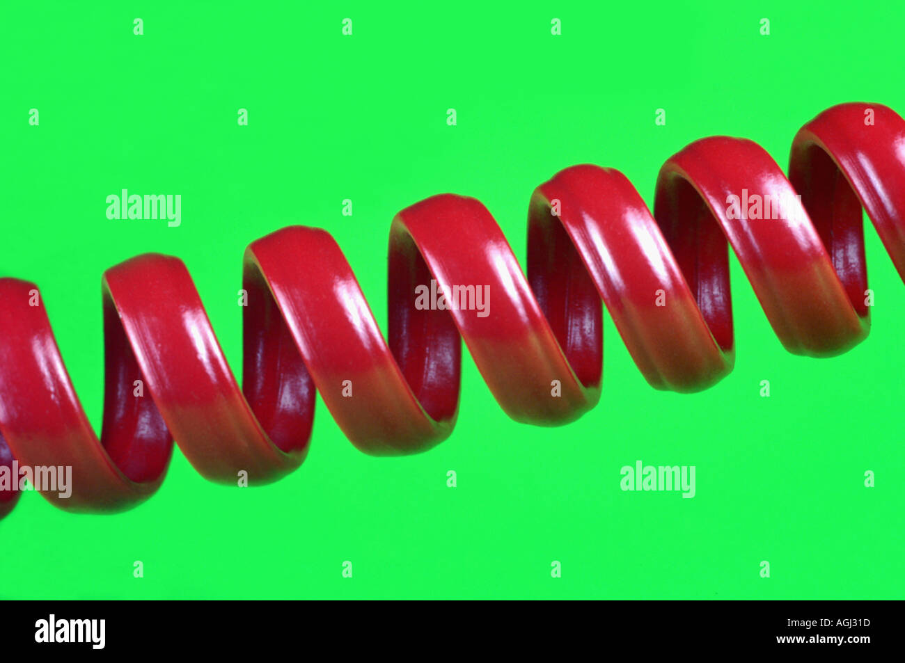 Red telephone cord close up Stock Photo - Alamy