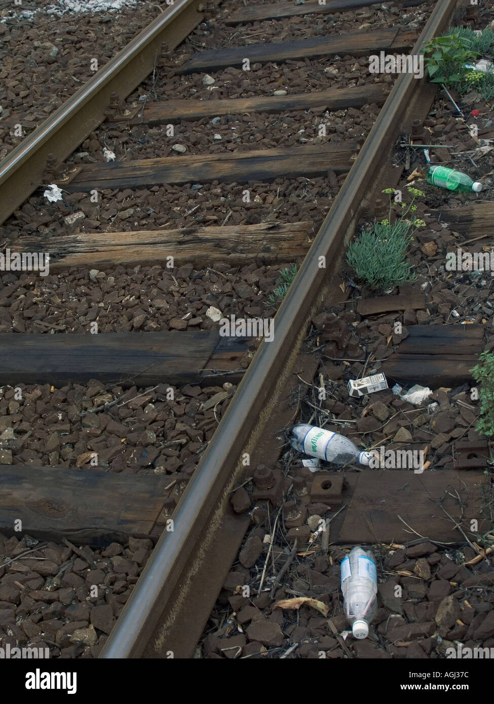 Litter and garbage alongside train track Stock Photo - Alamy