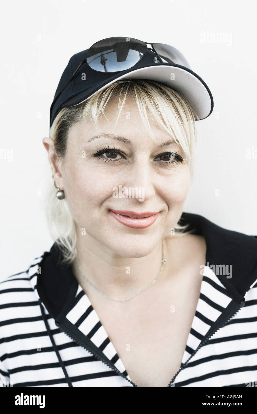 Portrait of a young woman smirking Stock Photo - Alamy