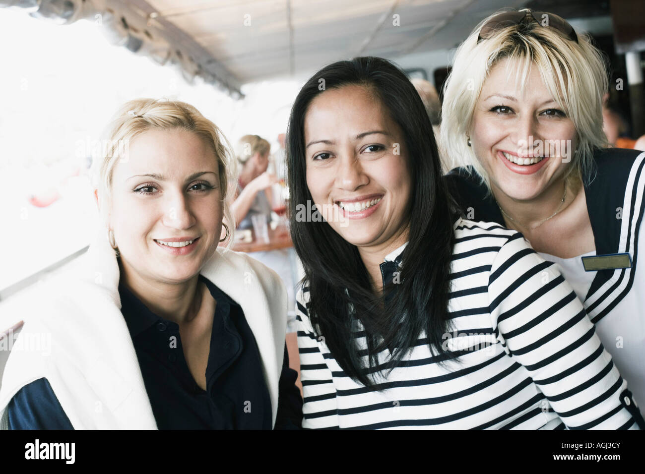 Portrait of three friends smiling Stock Photo - Alamy