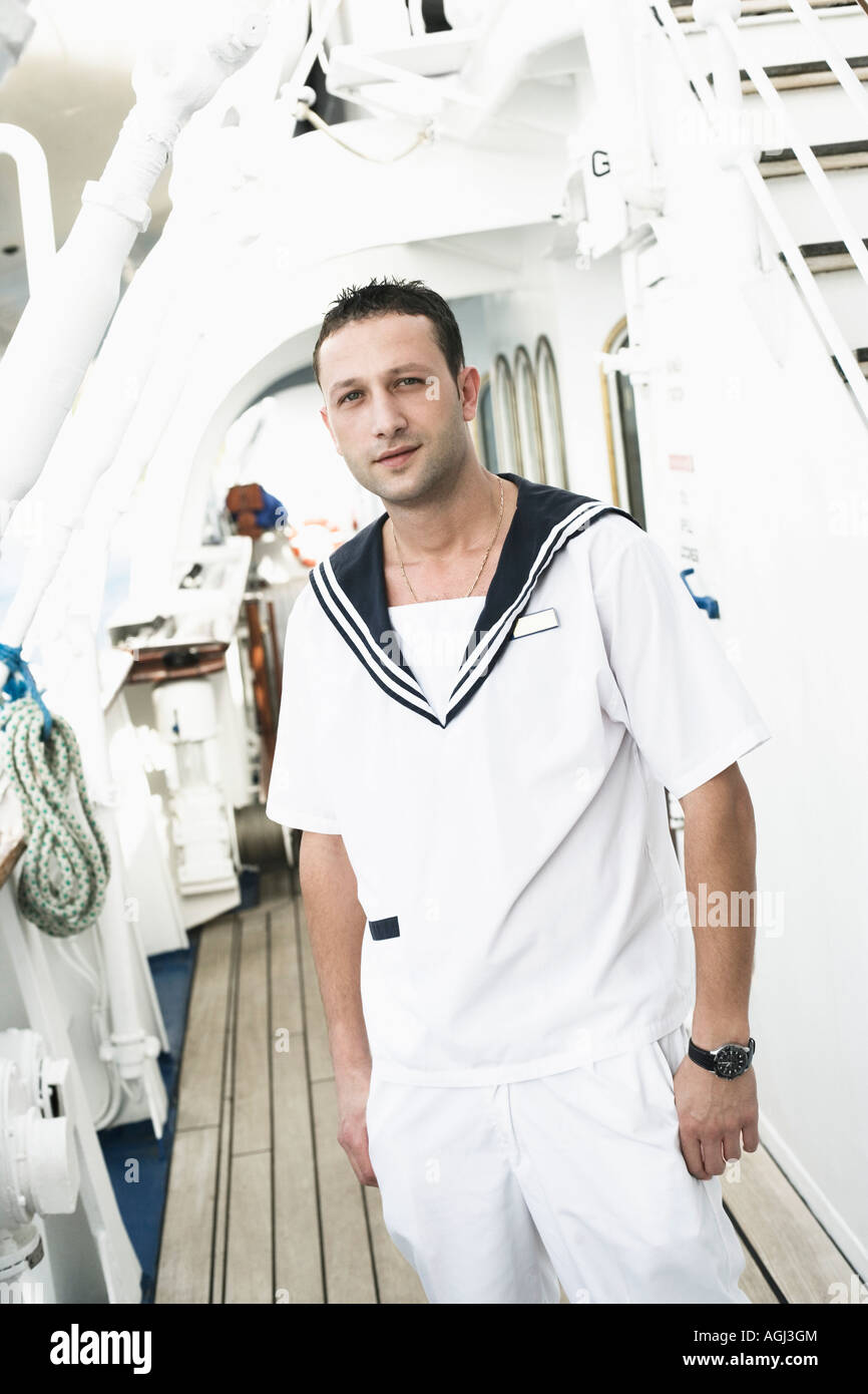 Portrait of a young man standing on the deck of a cruise ship Stock ...