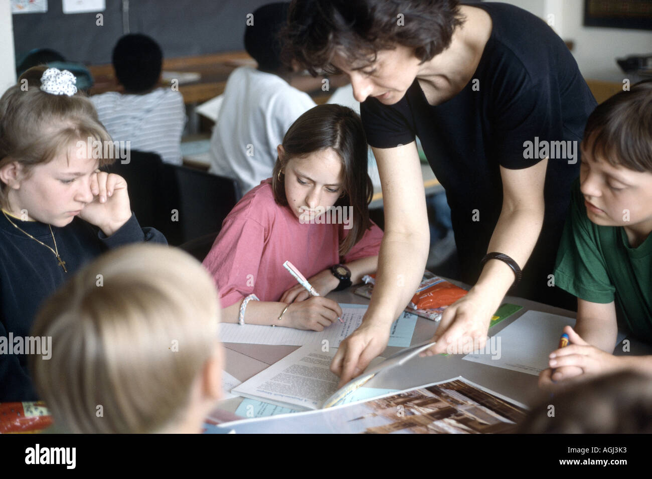 secondary classroom with teacher instructing Stock Photo - Alamy