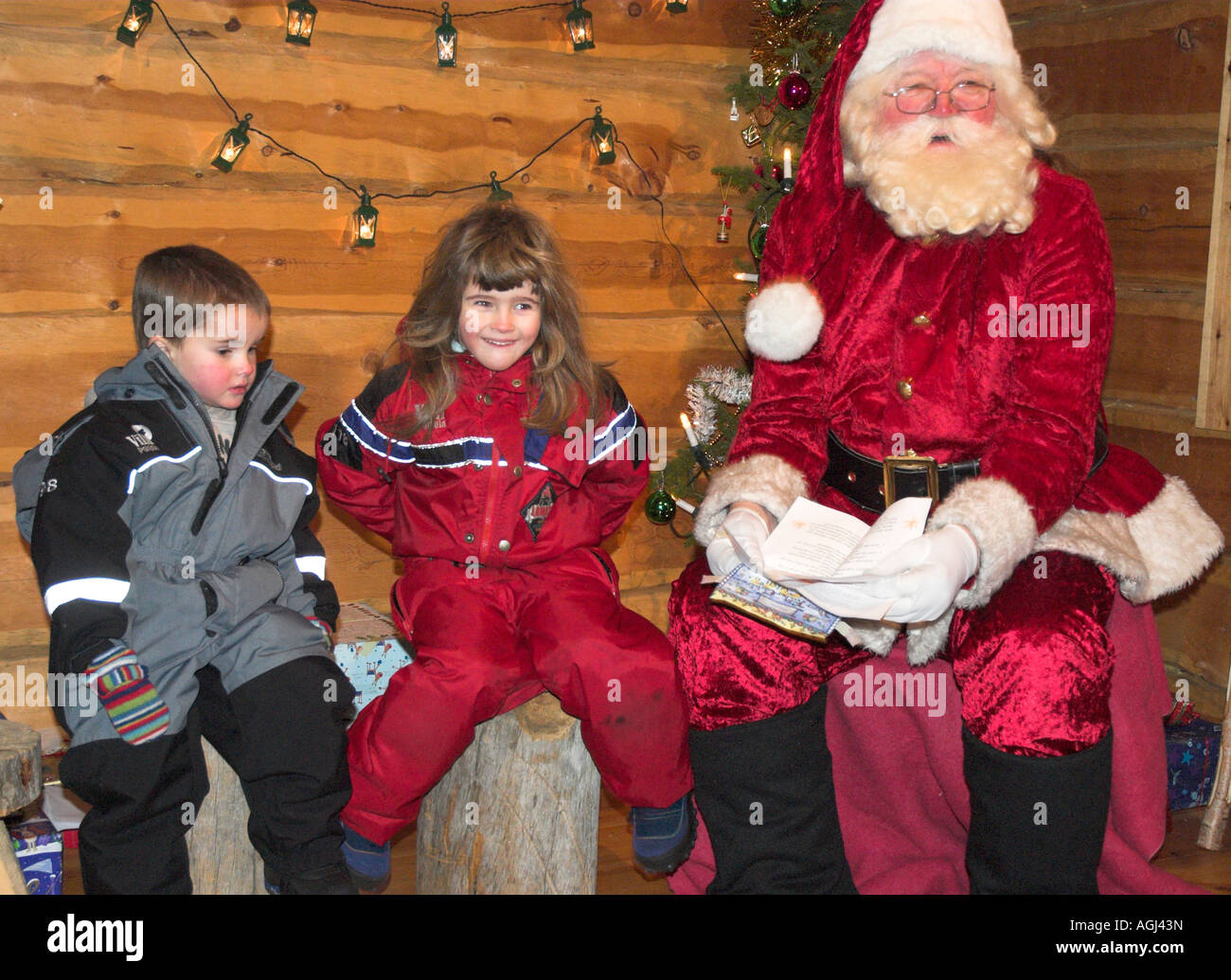 Children with the REAL Father Christmas Stock Photo - Alamy