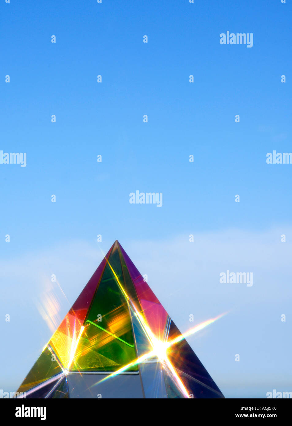Glass pyramid with light rays reflected prism like Stock Photo - Alamy