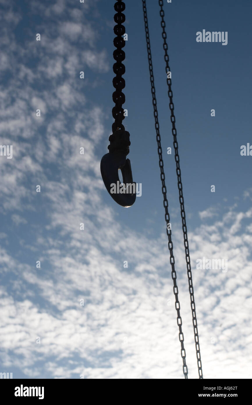A hook on a pulley system against an attractive cloud formation in a ...