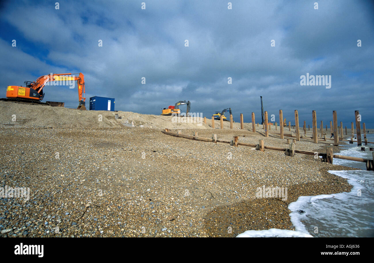 Diggers on the beach Stock Photo - Alamy